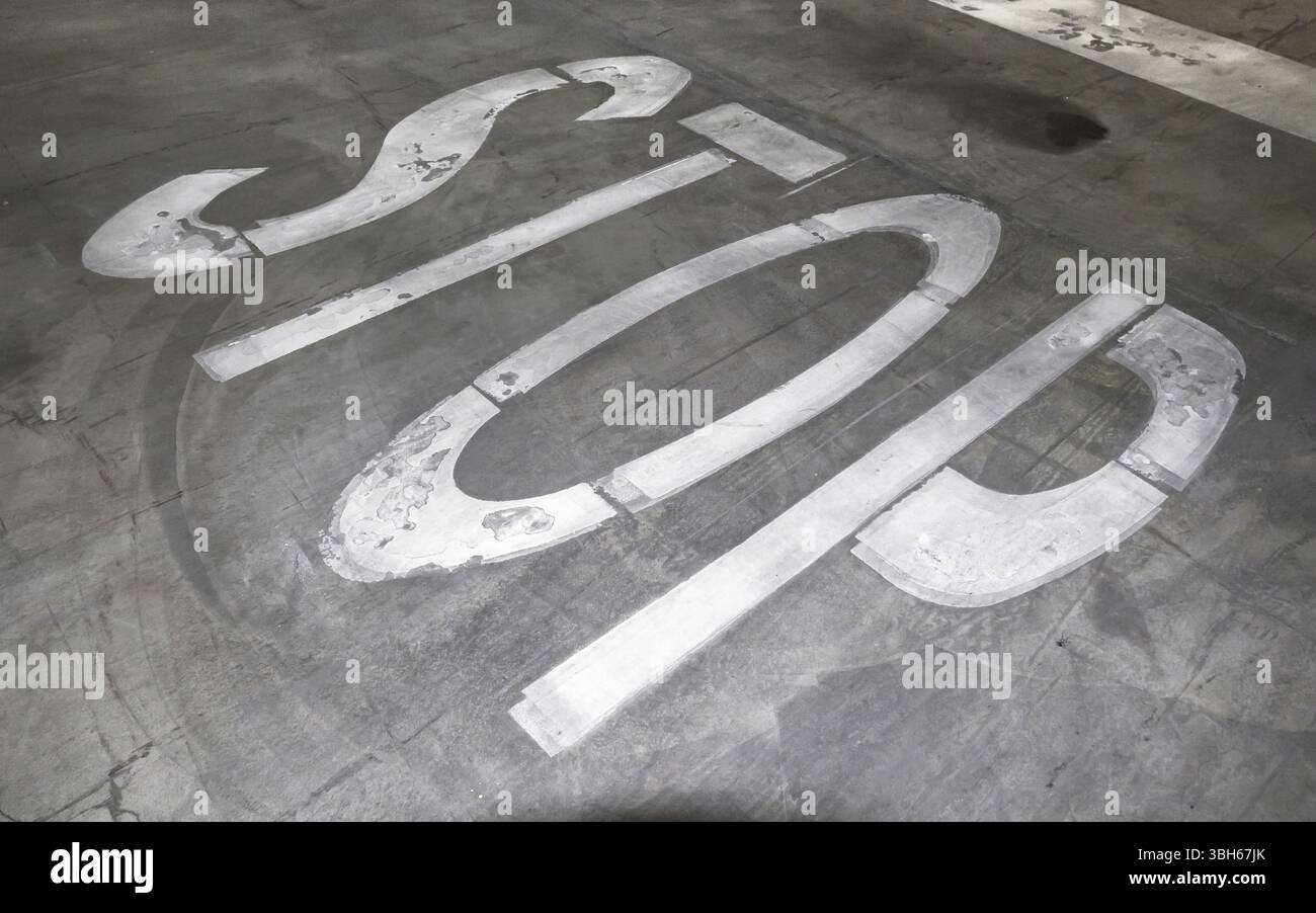 Stop sign on the ground Stock Photo - Alamy