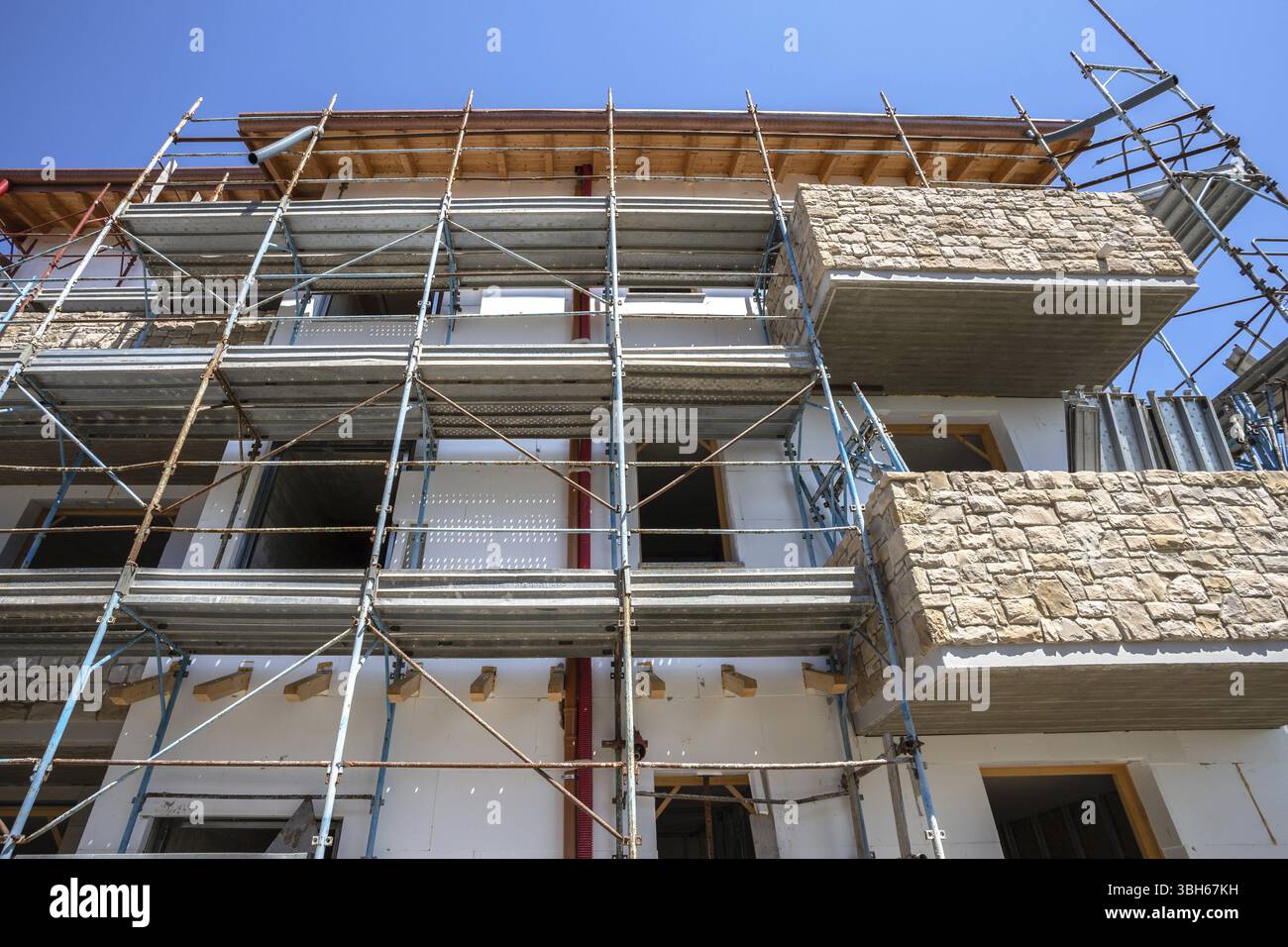 Scaffolding near a house under construction for external plaster works ...
