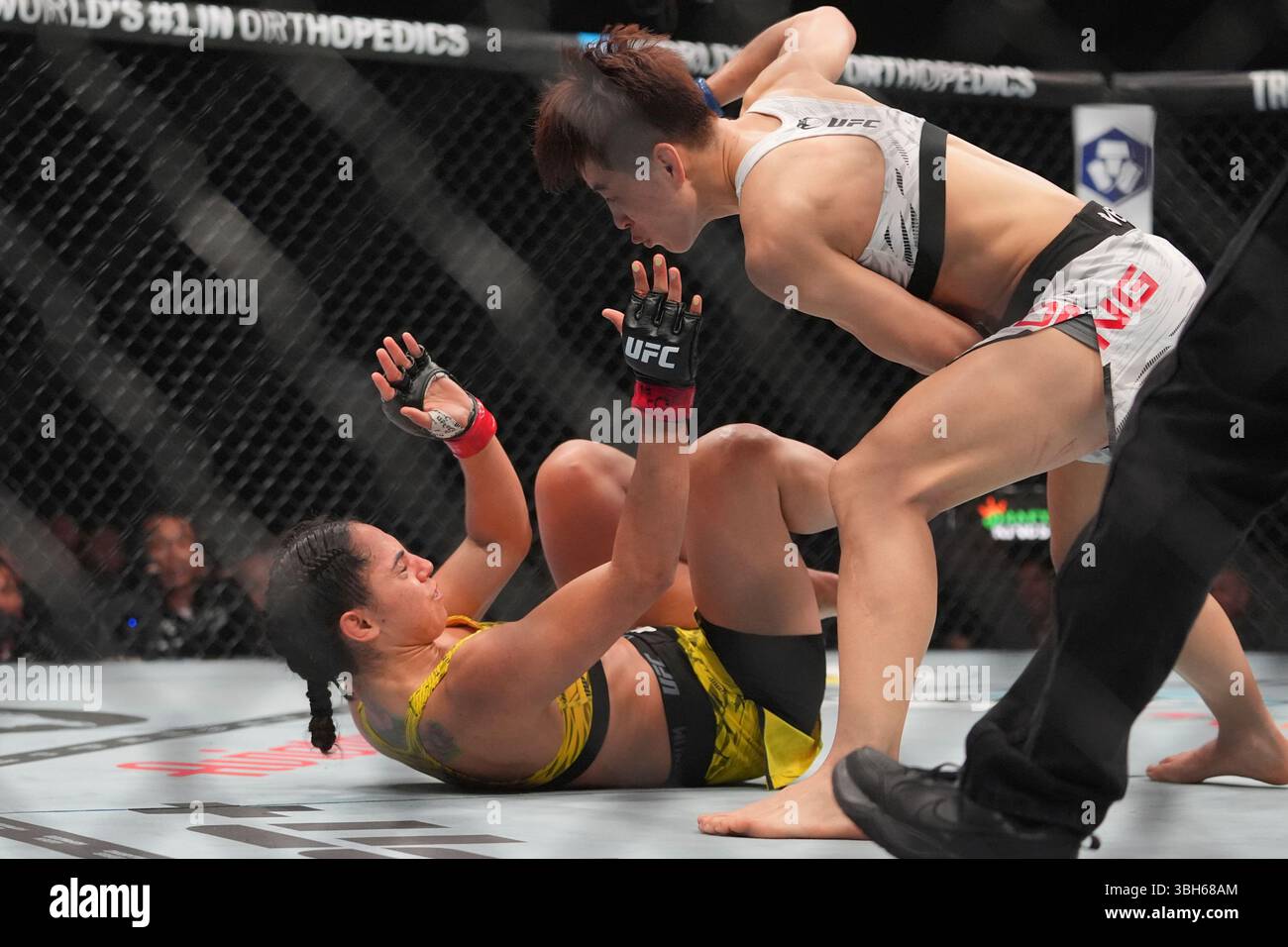 China's Wang Cong, right, punches Brazil's Ariane da Silva during the ...