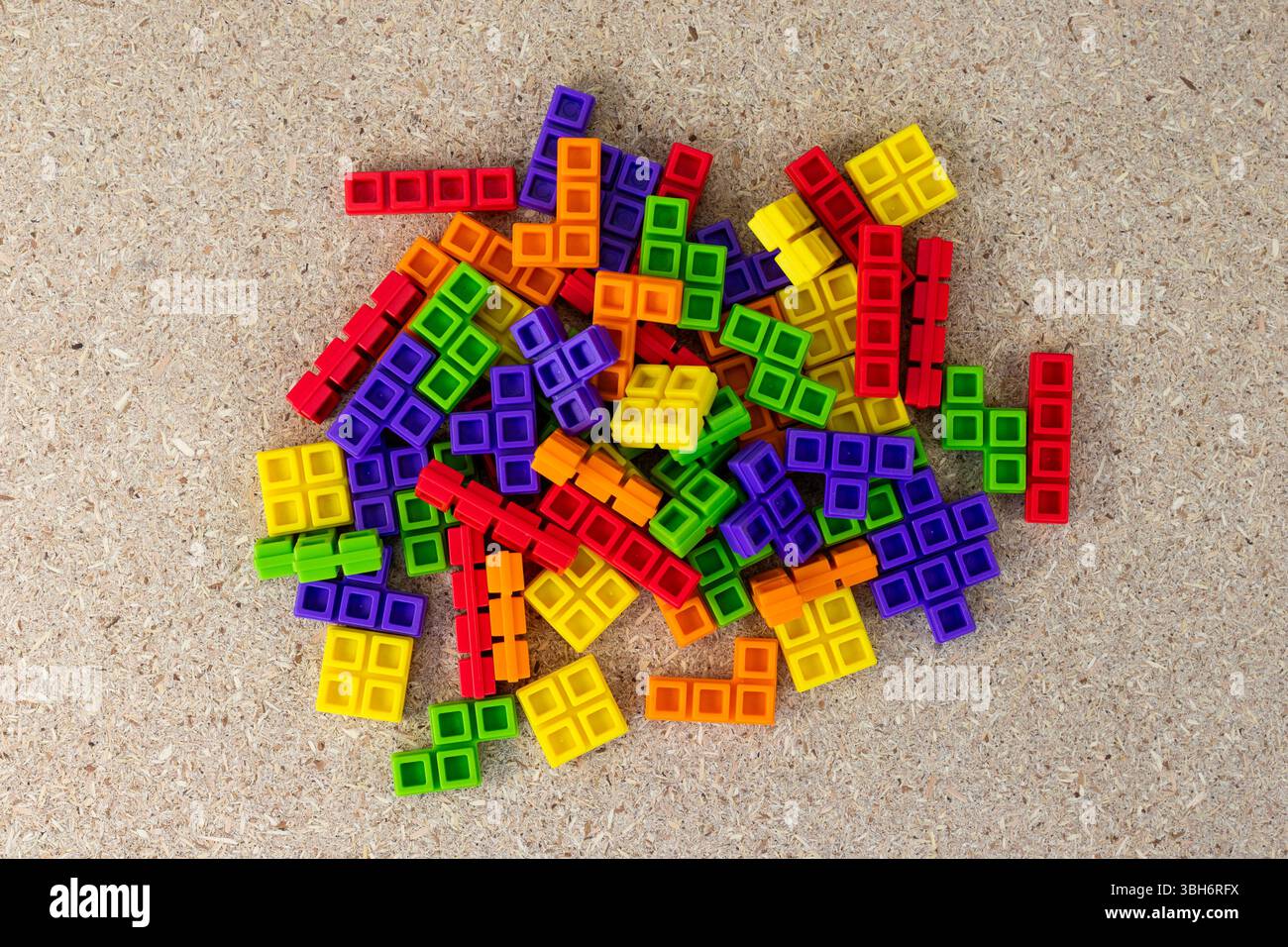 Pile of Colorful Interlocking Toy Blocks on Wooden Surface Stock Photo ...