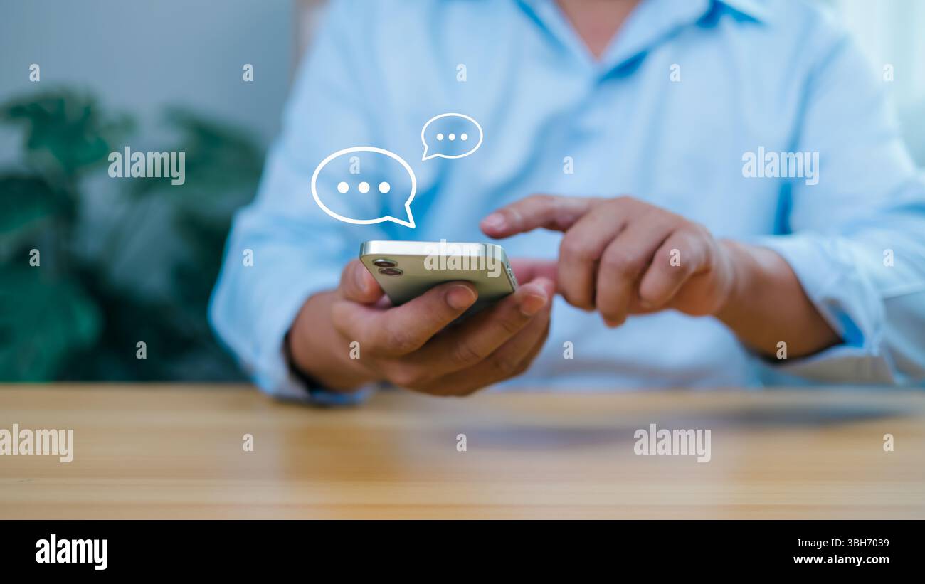 Person holding a smartphone with chat bubbles, representing online ...