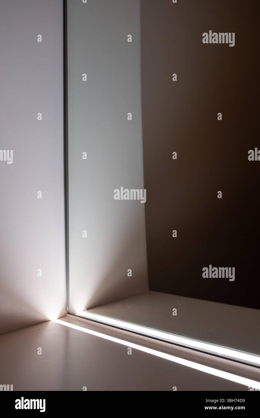 Integrated linear lighting on the cabinet, in front of the mirror Stock ...