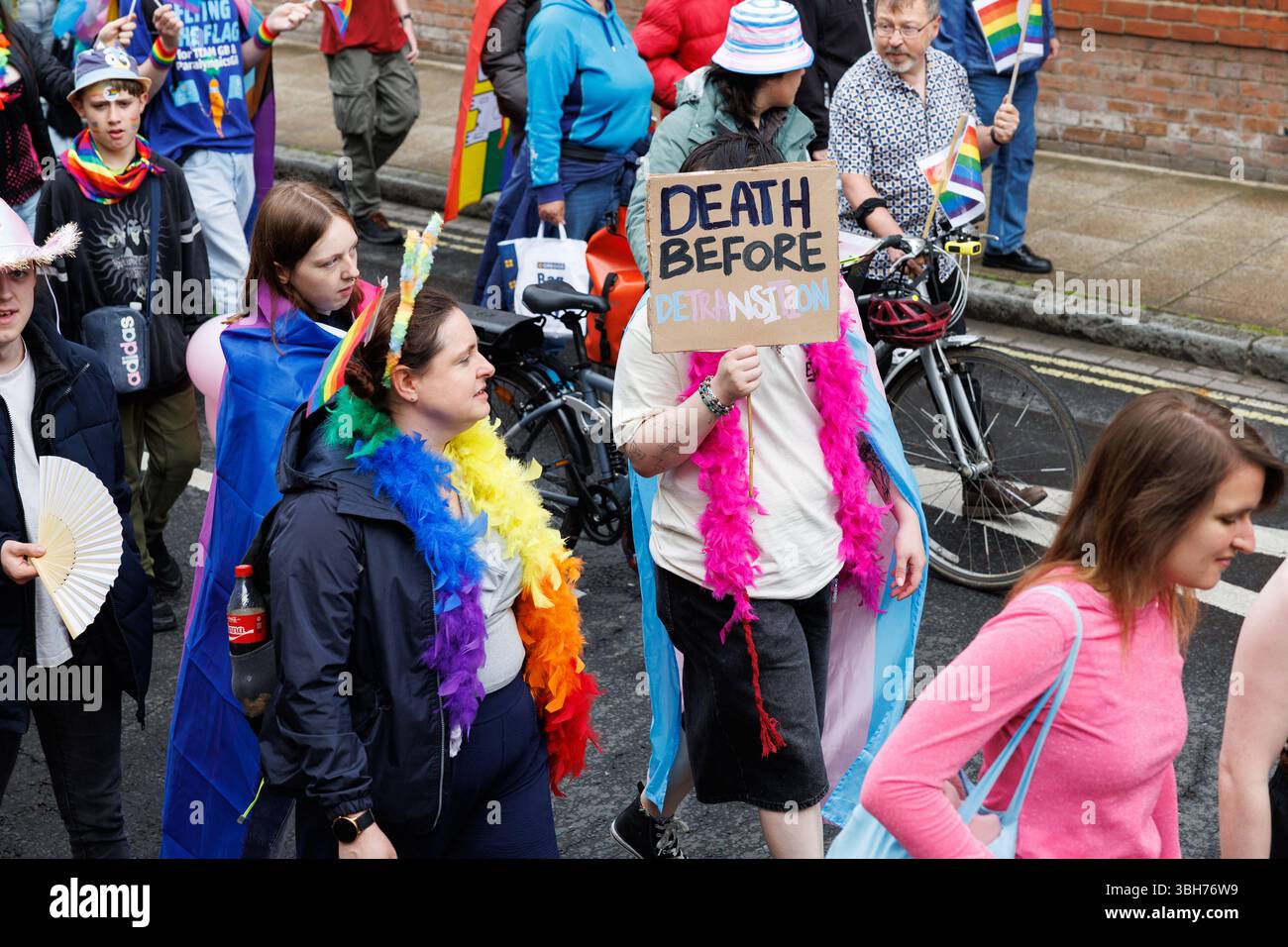 York, UK. 7 June, 2025. A transgender person holds up a "Death Before ...