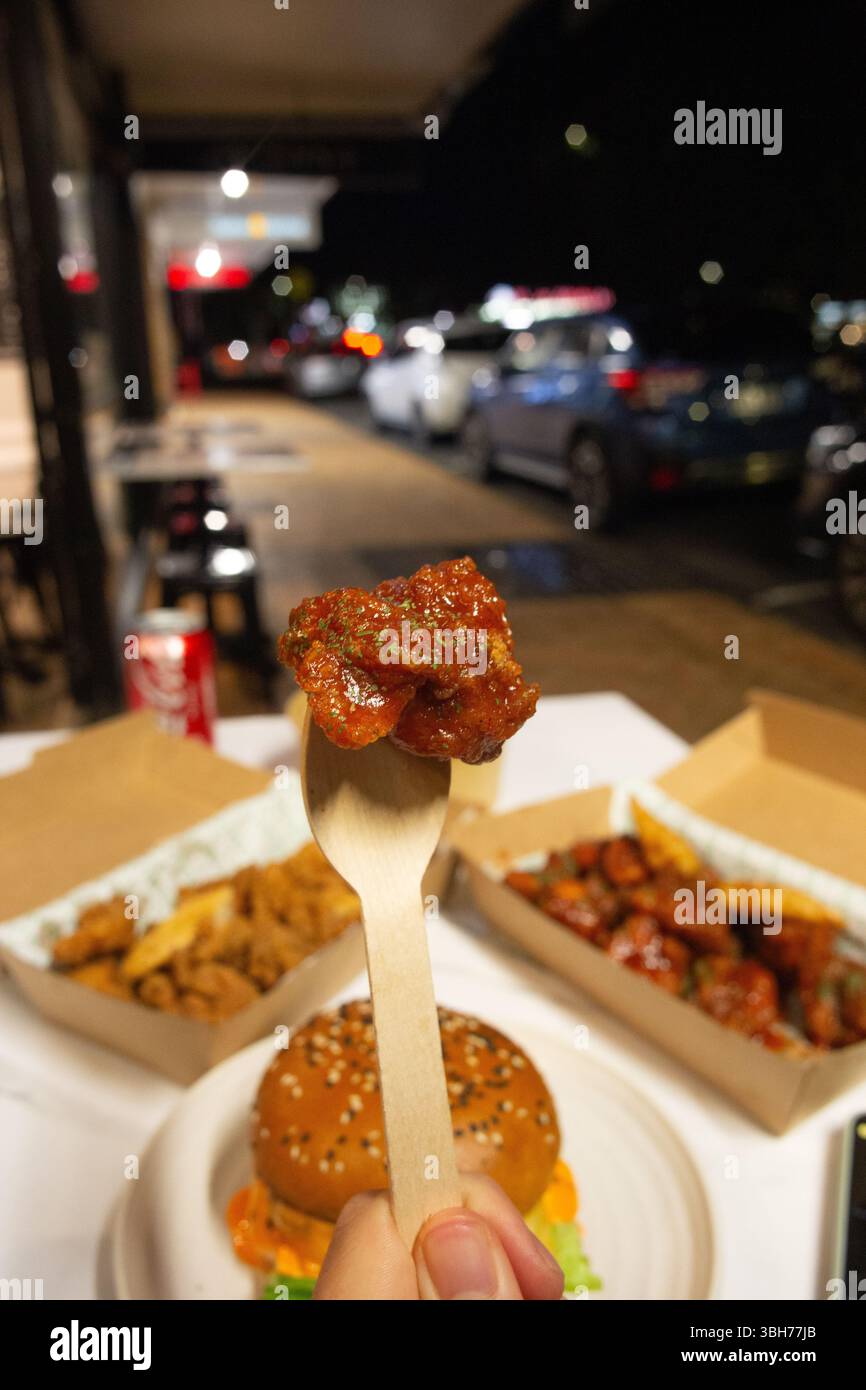 Korean deep dried spicy red chicken sauce in a paper takeaway box Stock ...
