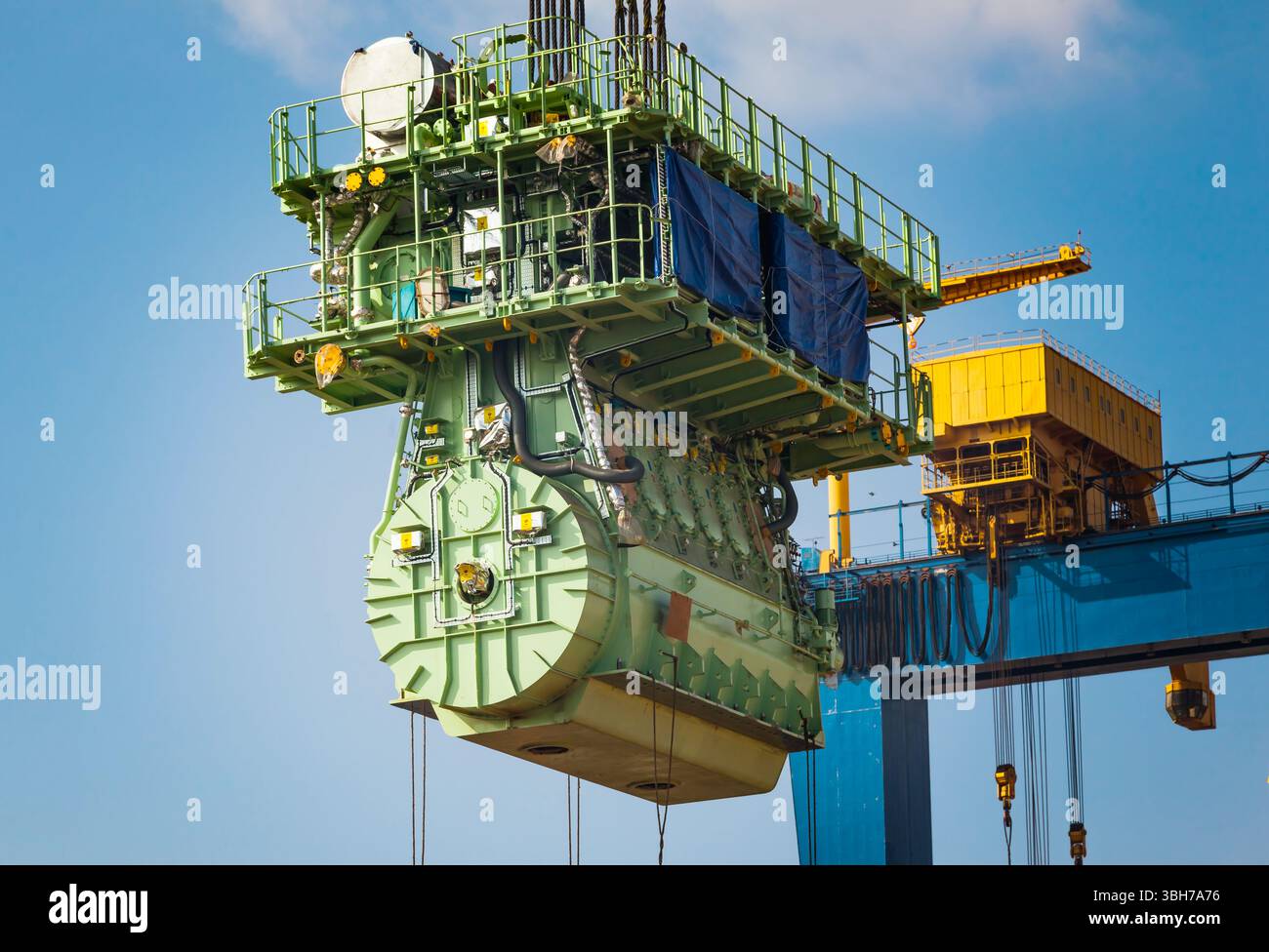 Transportation of a large marine engine by a port crane using steel ...