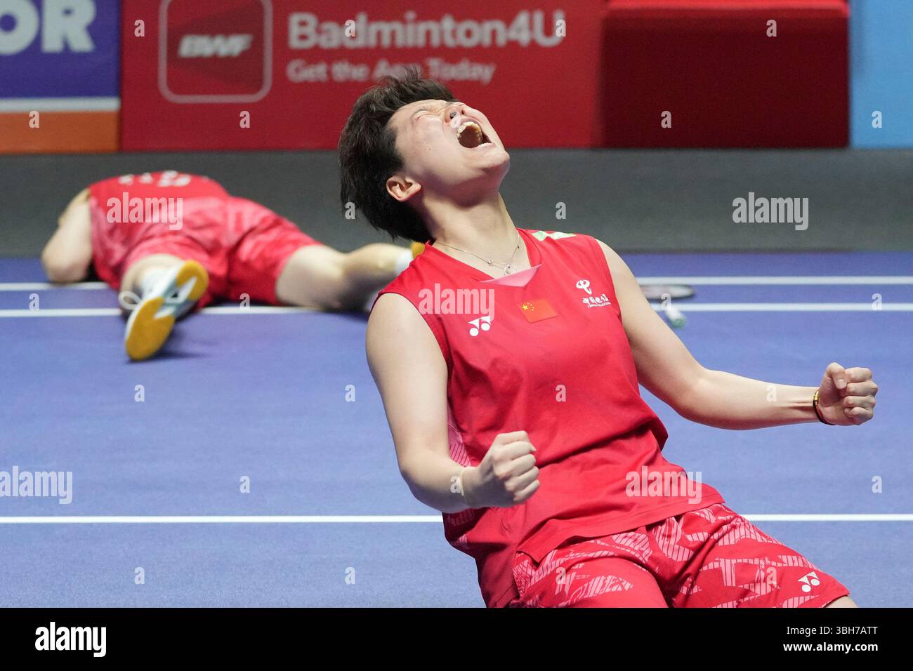 China's Liu Shengshu, rear, and Tan Ning celebrate after defeating Malaysia's Pearly Tan and ...