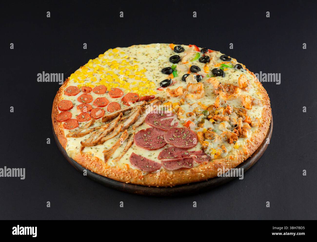 Pizza divided into several flavors: cheese, olives, salami, sausages ...