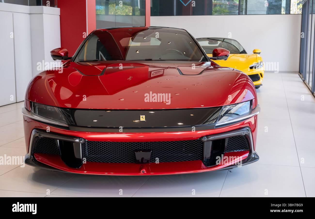 Ferrari 12Cilindri and Ferrari 296 GTS on a showroom floor Stock Photo ...