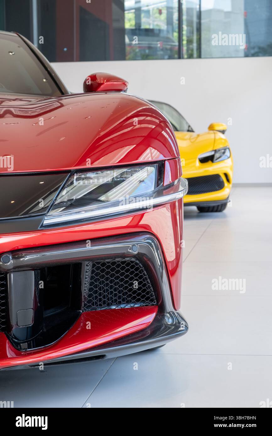 Ferrari 12Cilindri and Ferrari 296 GTS on a showroom floor Stock Photo ...