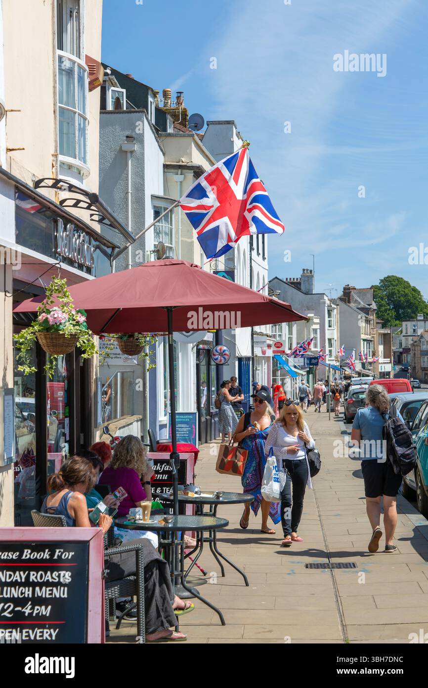 Union Jack flags on shops in street of historic buildings, The Strand ...