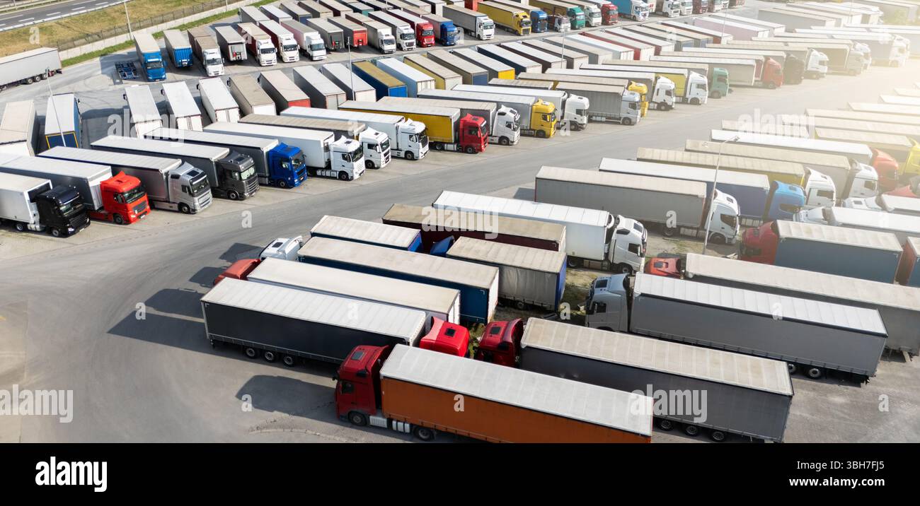 Aerial view of a large truck parking lot at a logistics hub, with ...