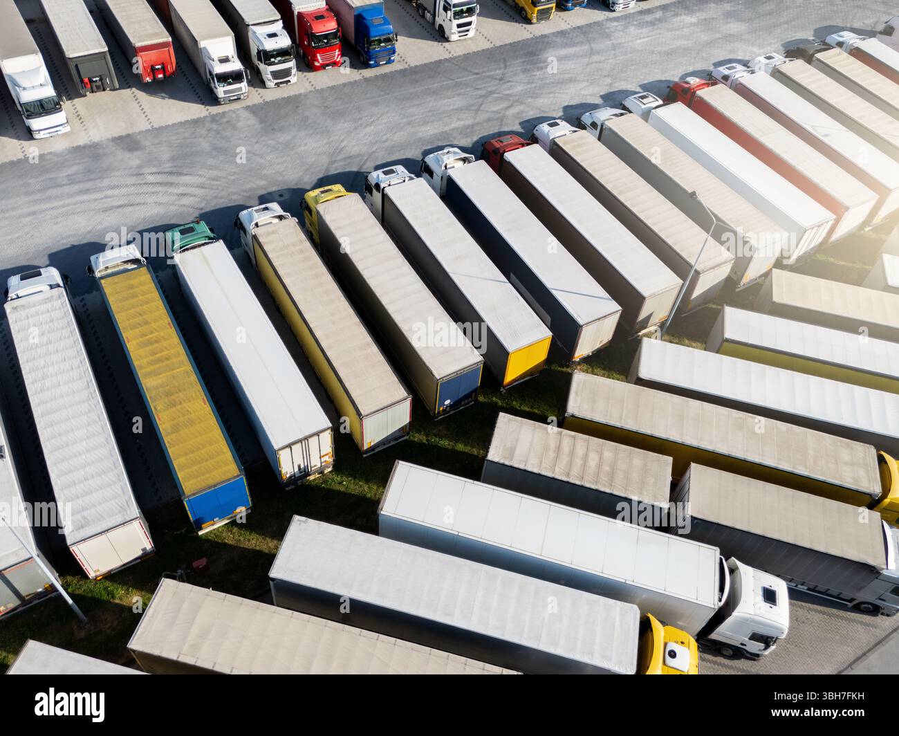 Aerial view of a large truck parking lot at a logistics hub, with ...