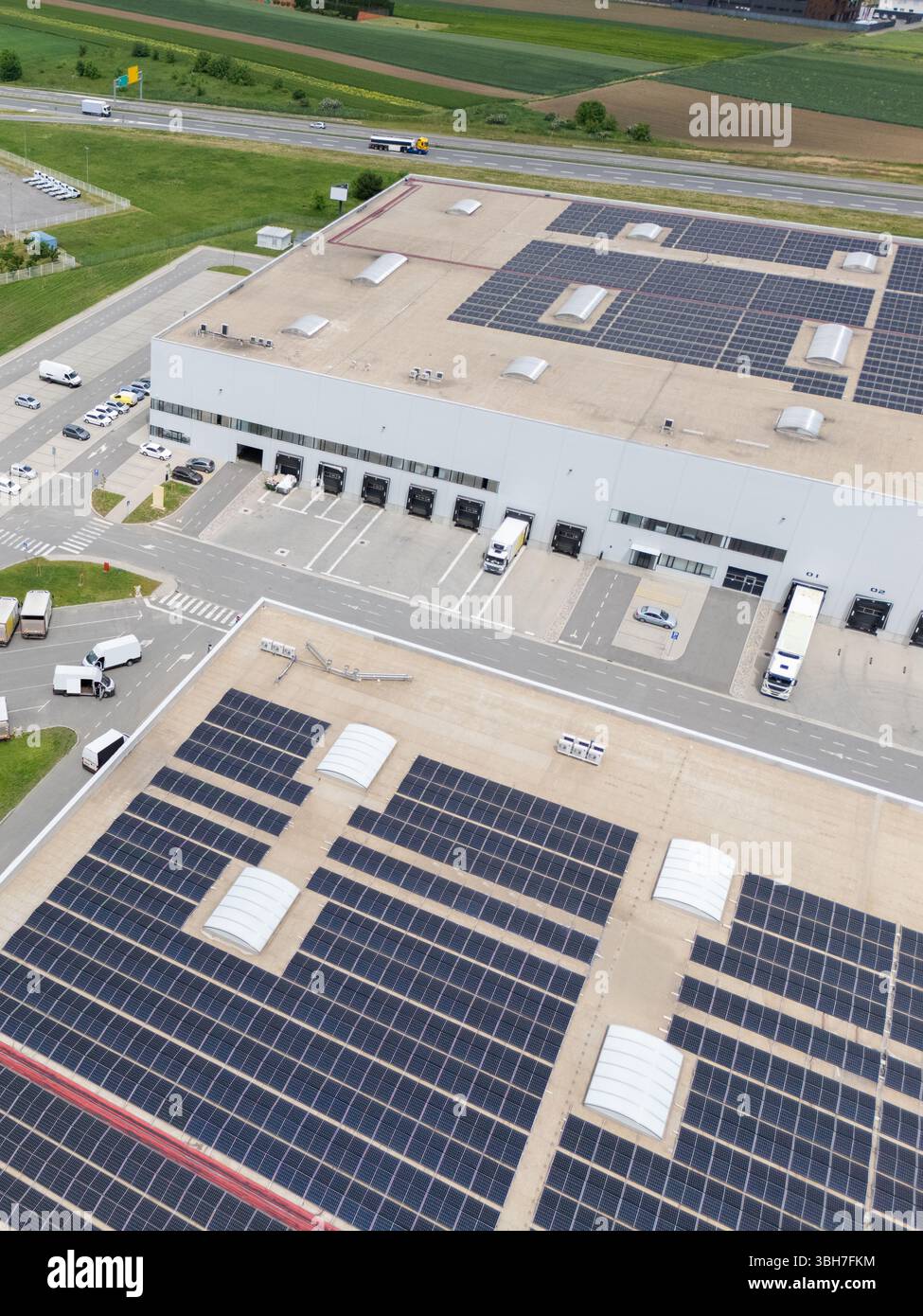 Logistic center with solar panels on roof. Aerial view Stock Photo - Alamy