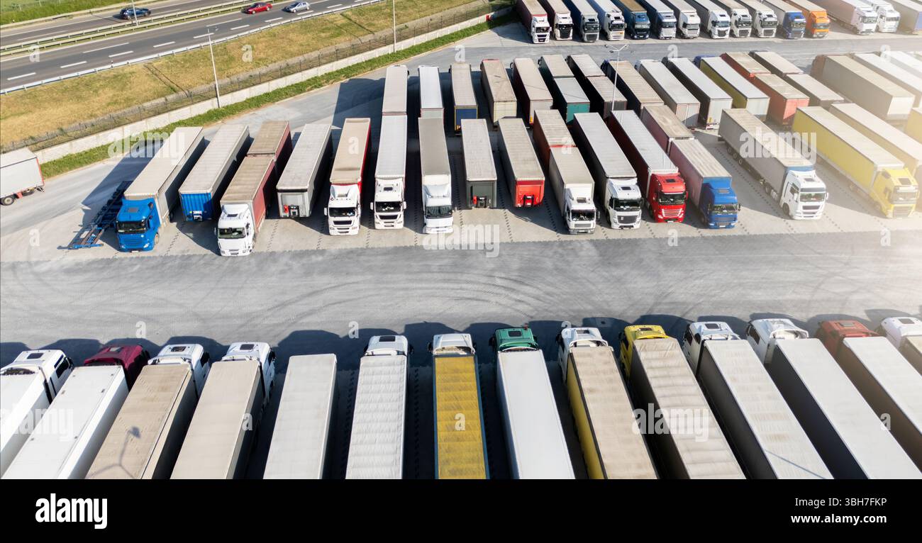 Aerial view of a large truck parking lot at a logistics hub, with ...