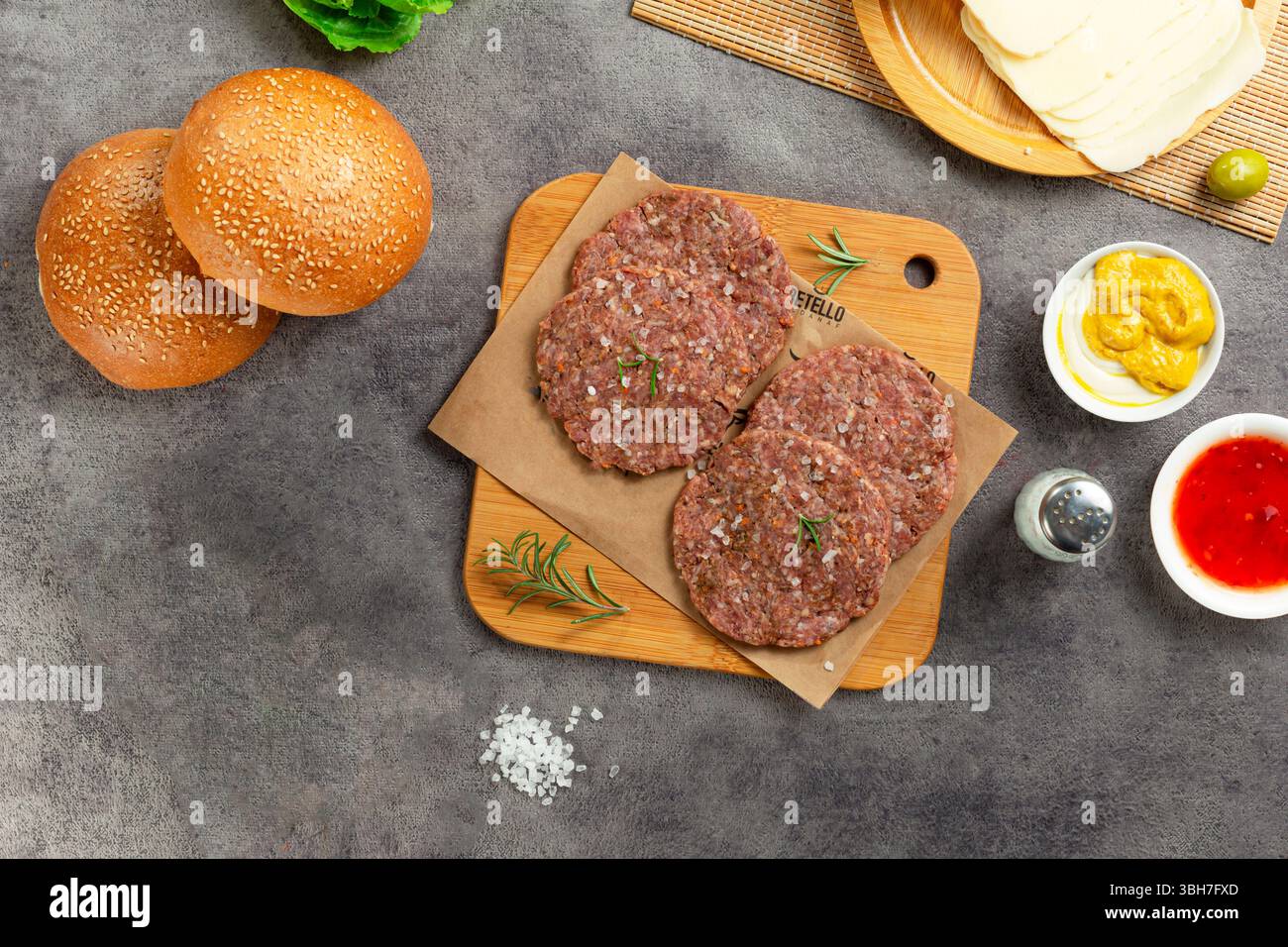 Raw beef burger patty, top view Stock Photo - Alamy