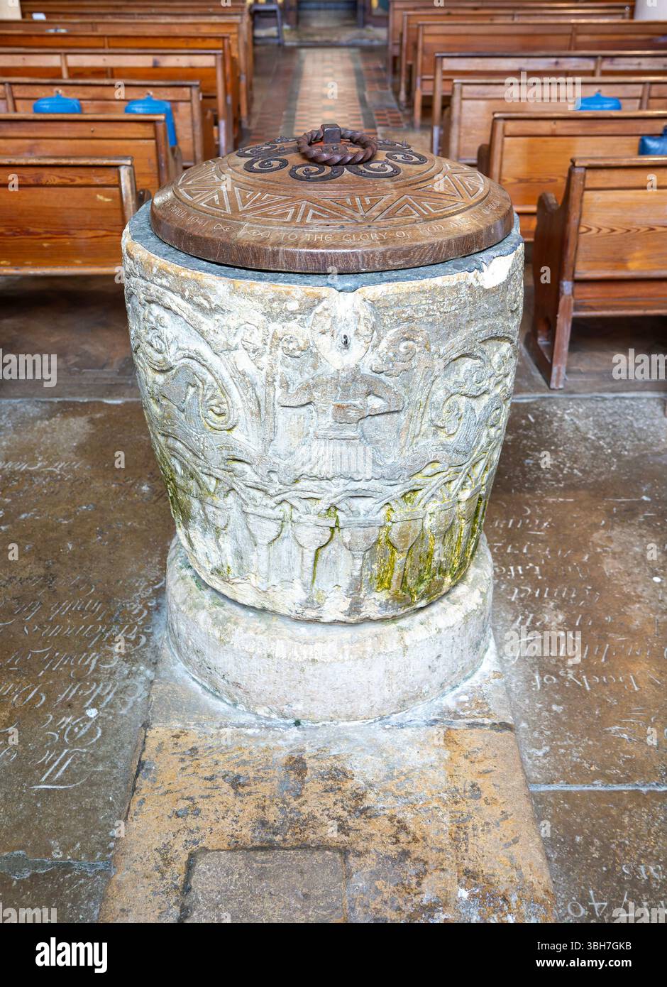 Historic baptismal font inside village parish church of Saint James ...