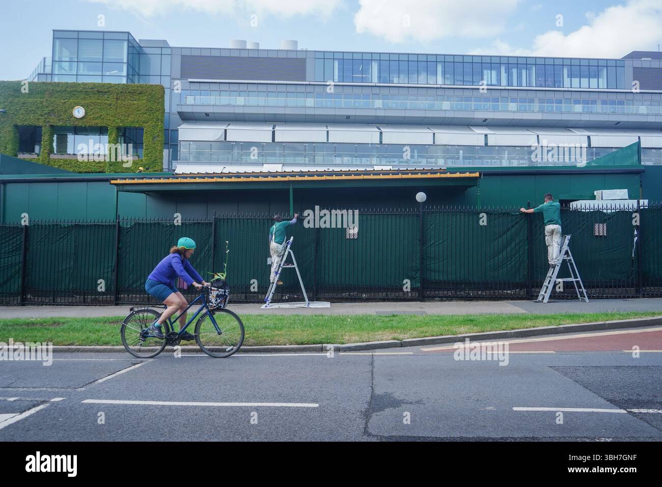 Wimbledon London, UK. 8 June 2025 Staff paint the metal perimeter ...
