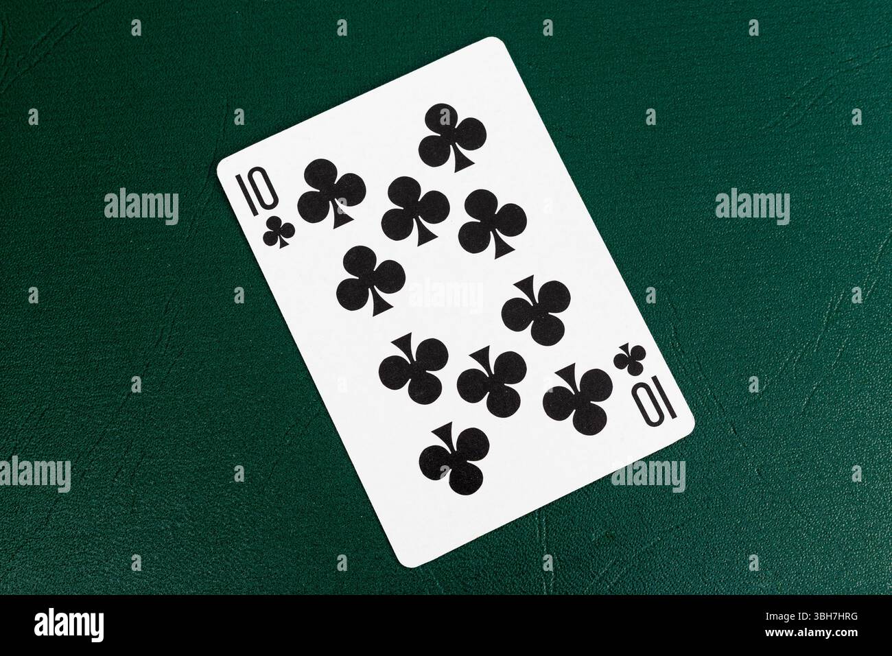 Ten of Clubs Playing Card on Green Poker Table. Top View Stock Photo - Alamy