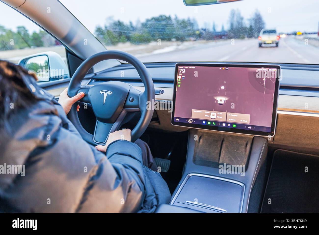 Interior view of Tesla Model Y electric SUV with autopilot navigation ...