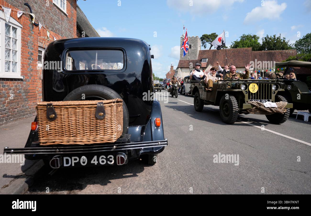 Military vehicles take part in a motorcade along the High street in ...