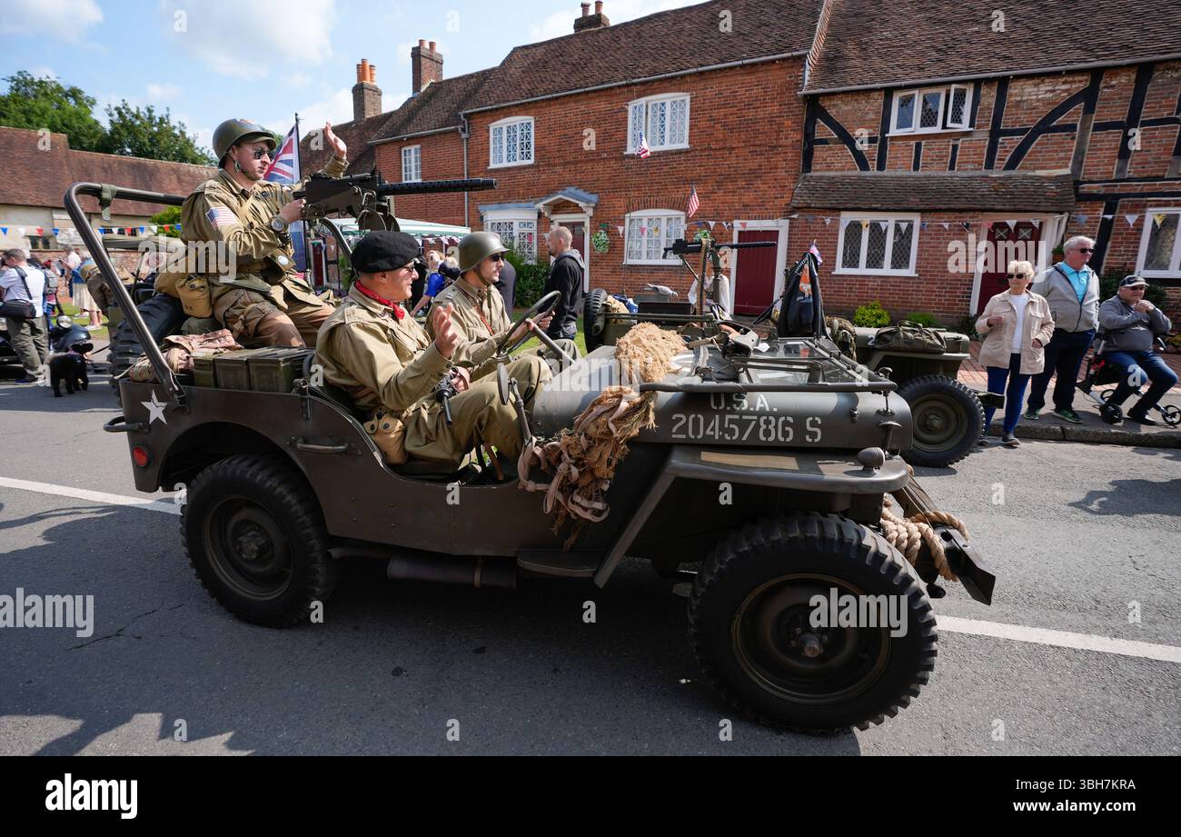 Military vehicles take part in a motorcade along the High street in ...