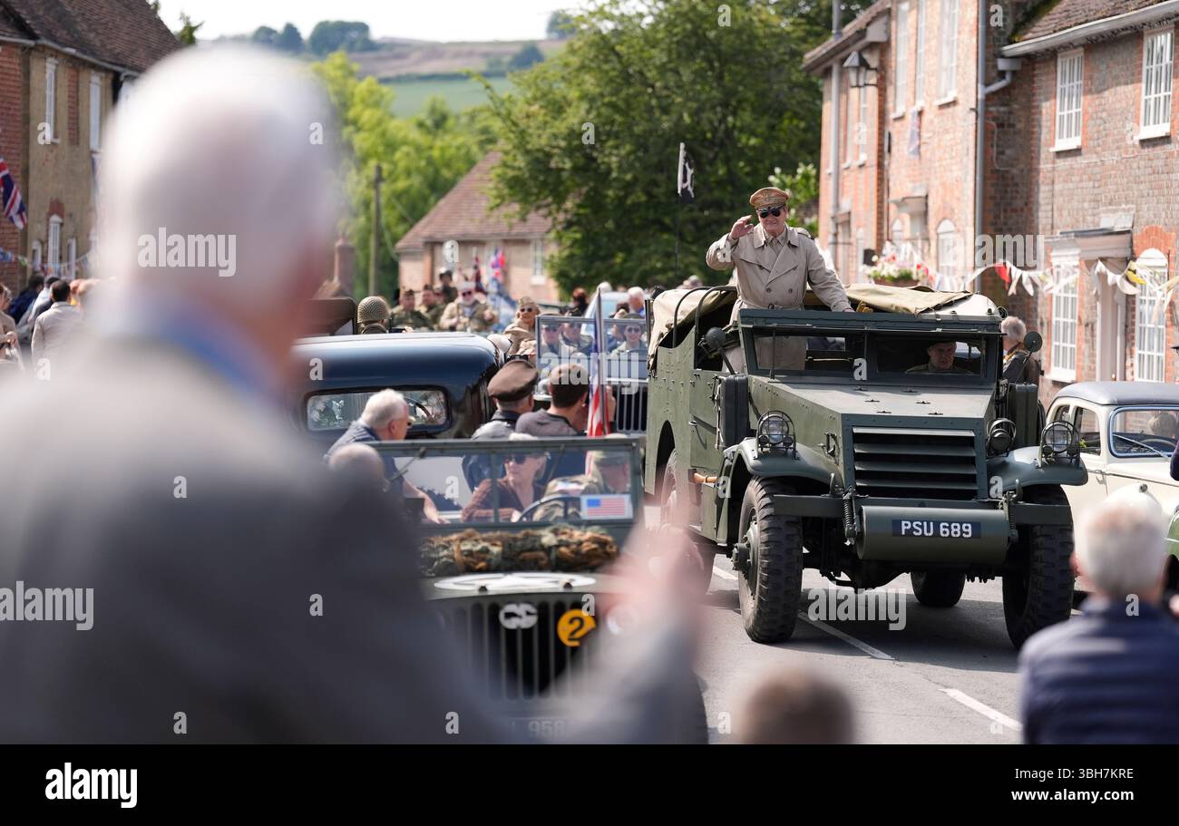 Military vehicles take part in a motorcade along the High street in ...