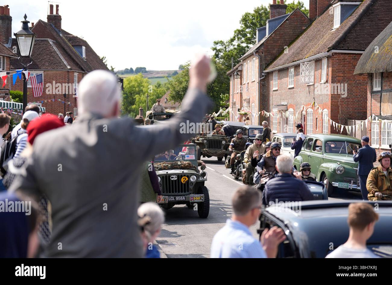 Military vehicles take part in a motorcade along the High street in ...