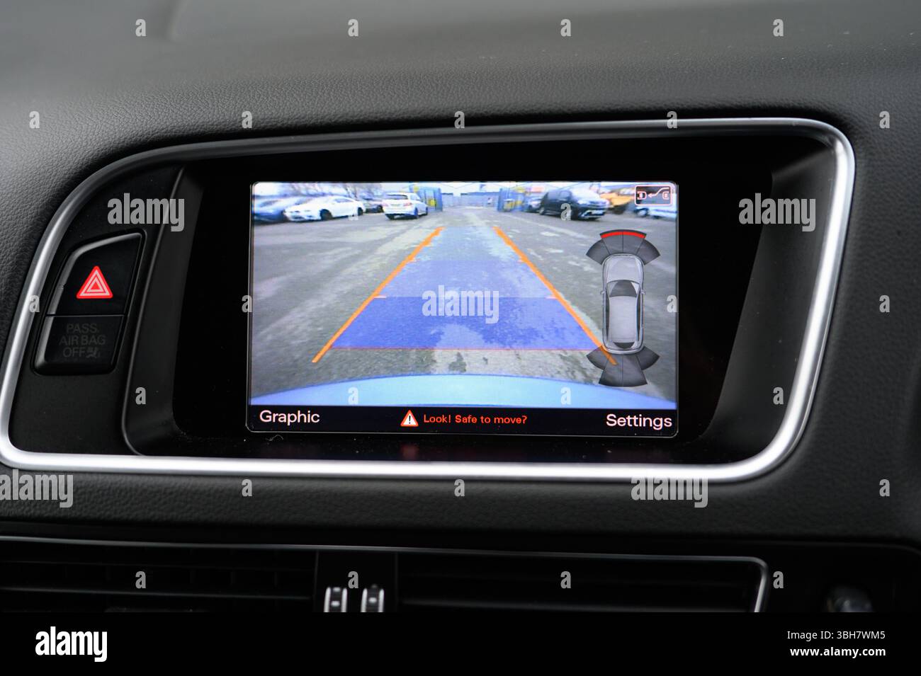 This image shows a cars infotainment screen while parking, featuring ...