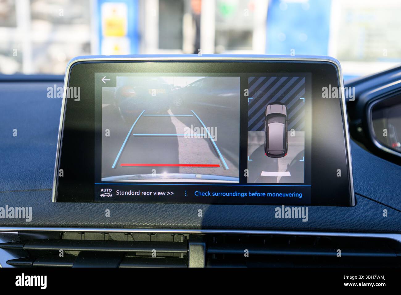 This image shows a cars infotainment screen while parking, featuring ...