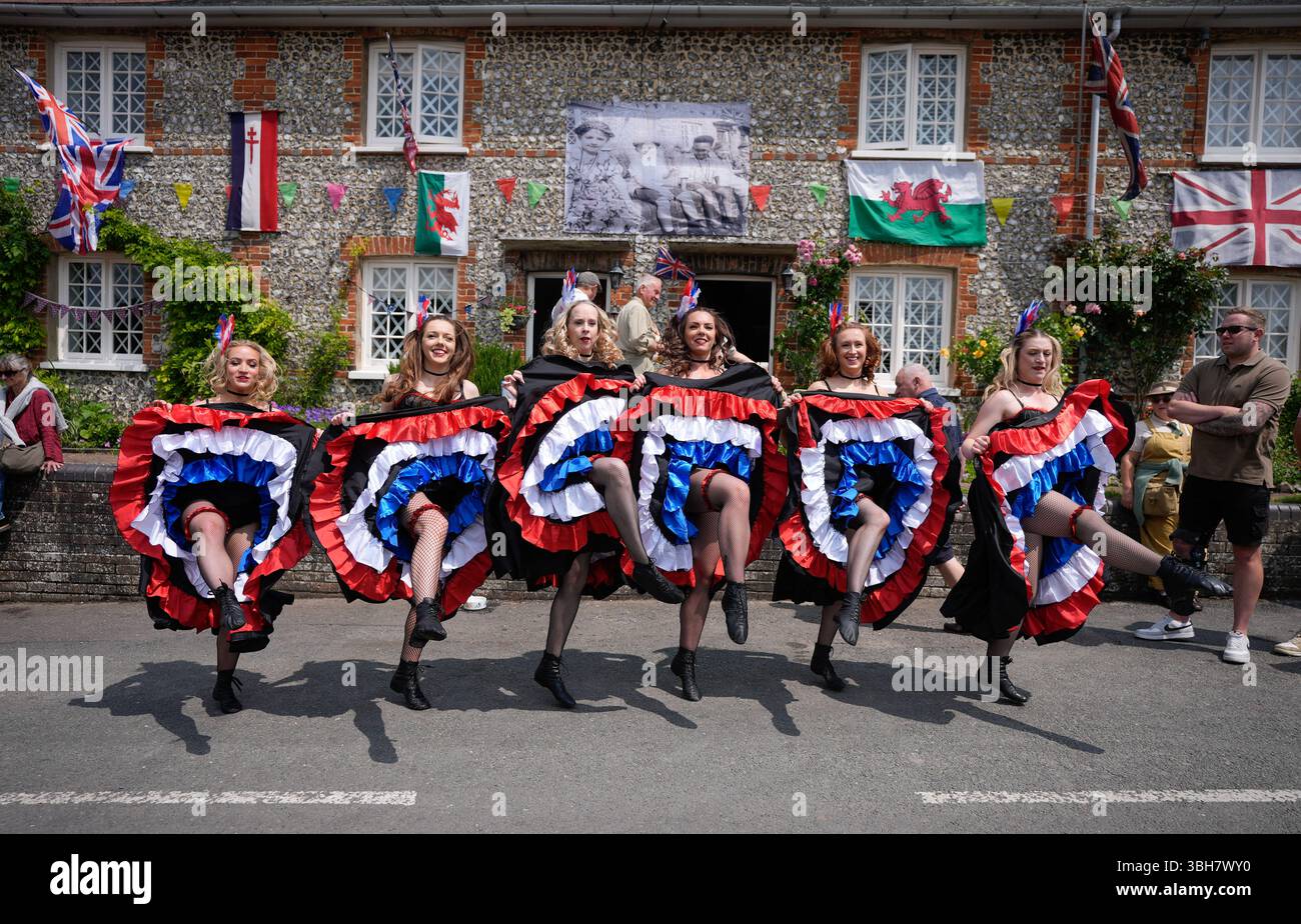 Members of The Butterflies event dancers perform a can-can dance in ...