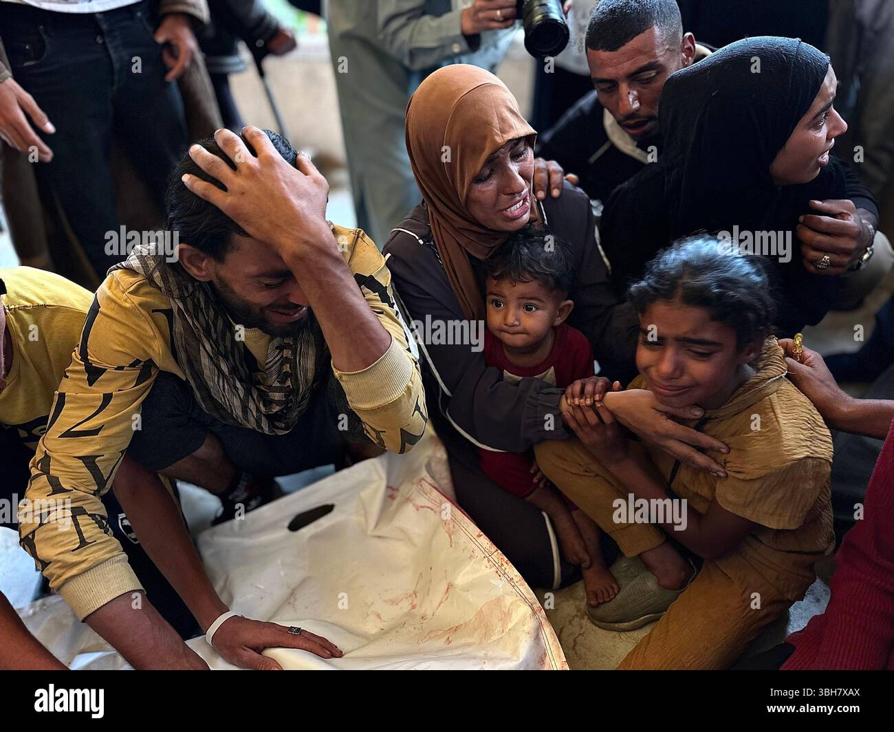 Mouners pray during the funeral of a Palestinian killed, in what the Gaza health ministry says ...