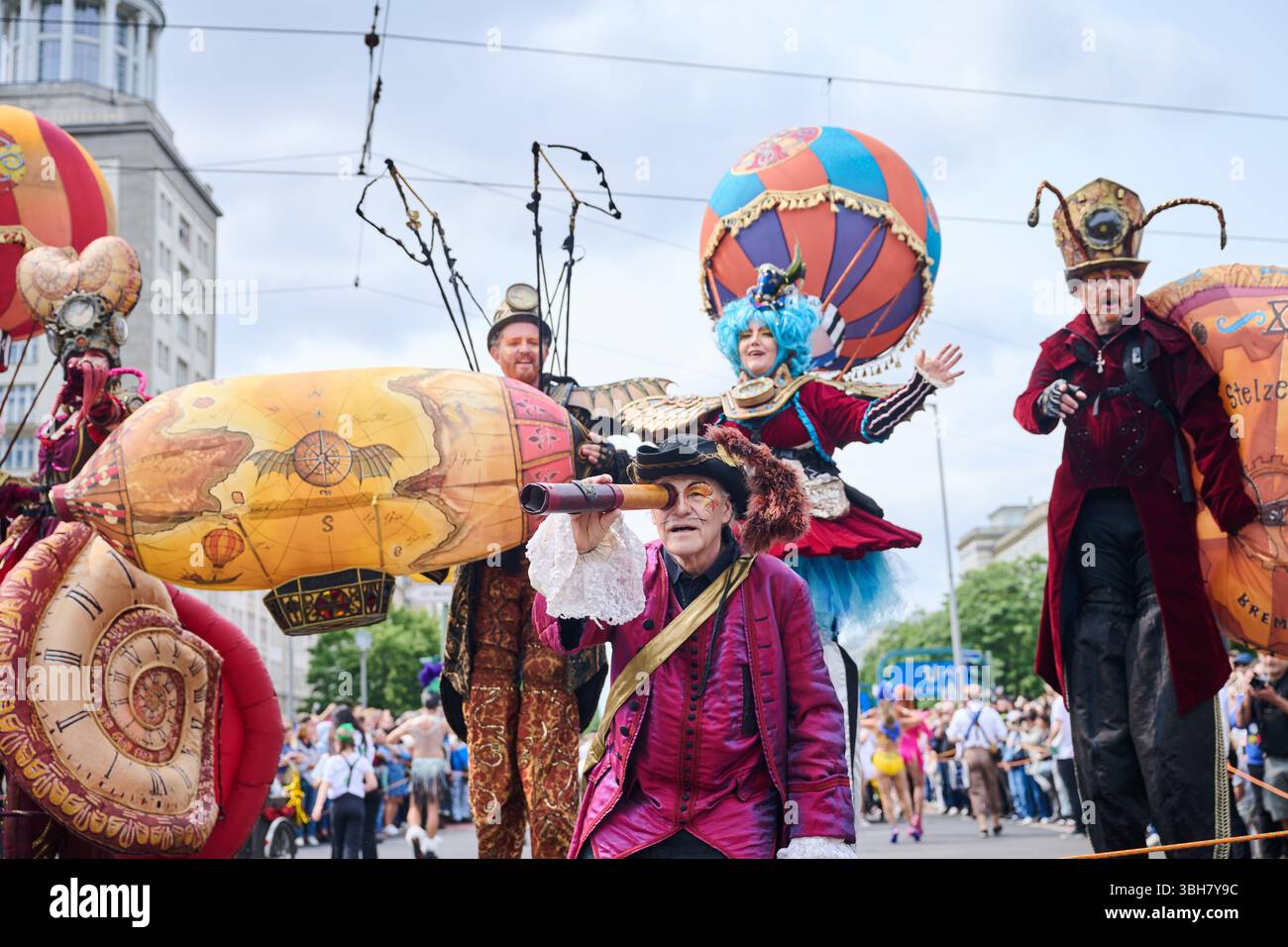 08 June 2025, Berlin: Dressed up people from different cultures dance ...