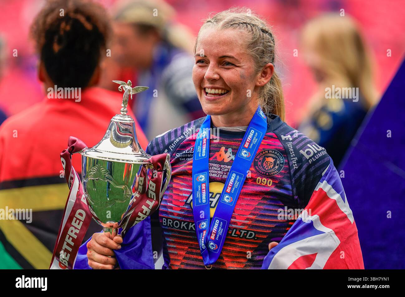LONDON, ENGLAND - JUNE 7: Remi Wilton of Wigan Warriors with the trophy ...