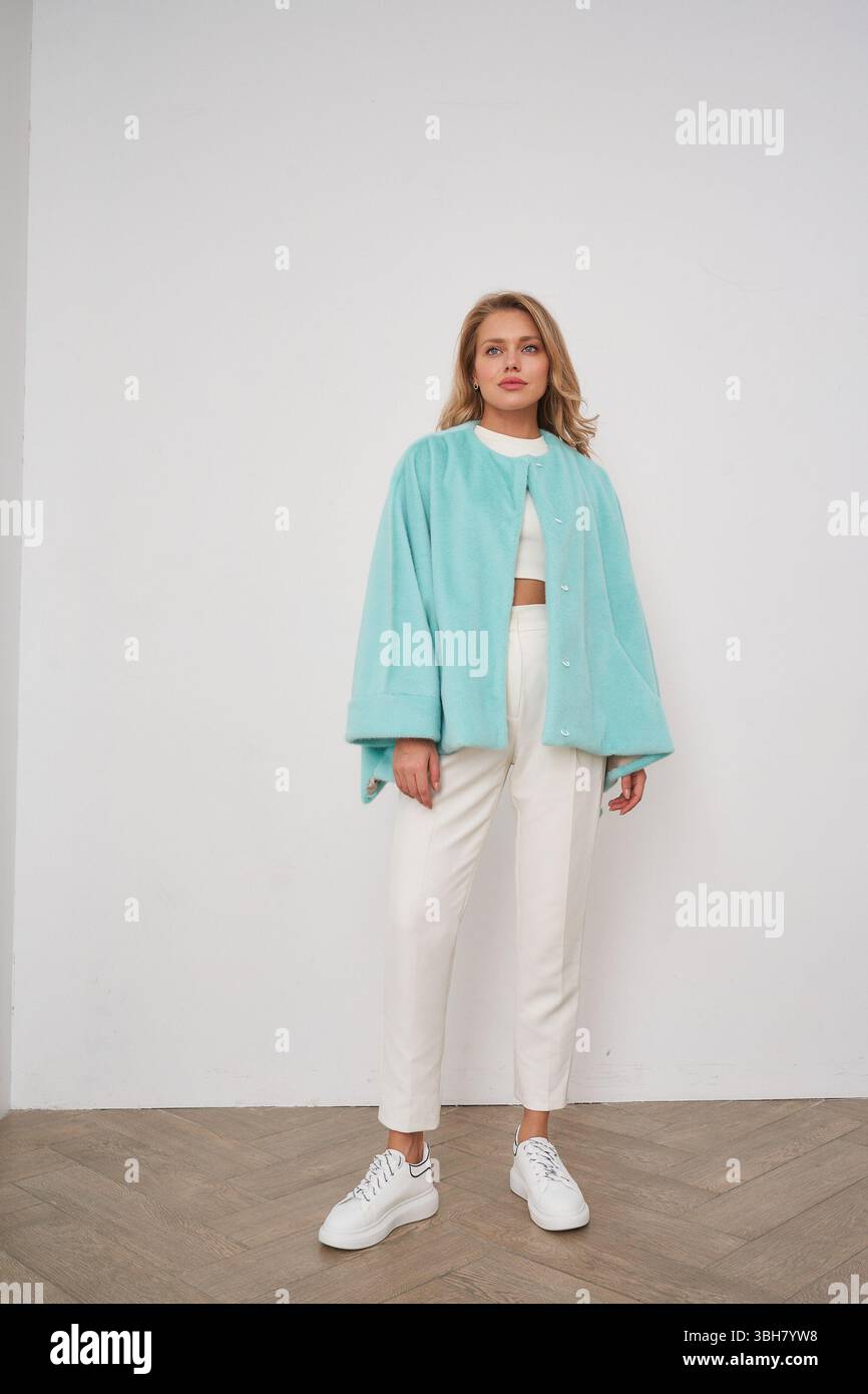 Woman stands poised dressed hi-res stock photography and images - Alamy