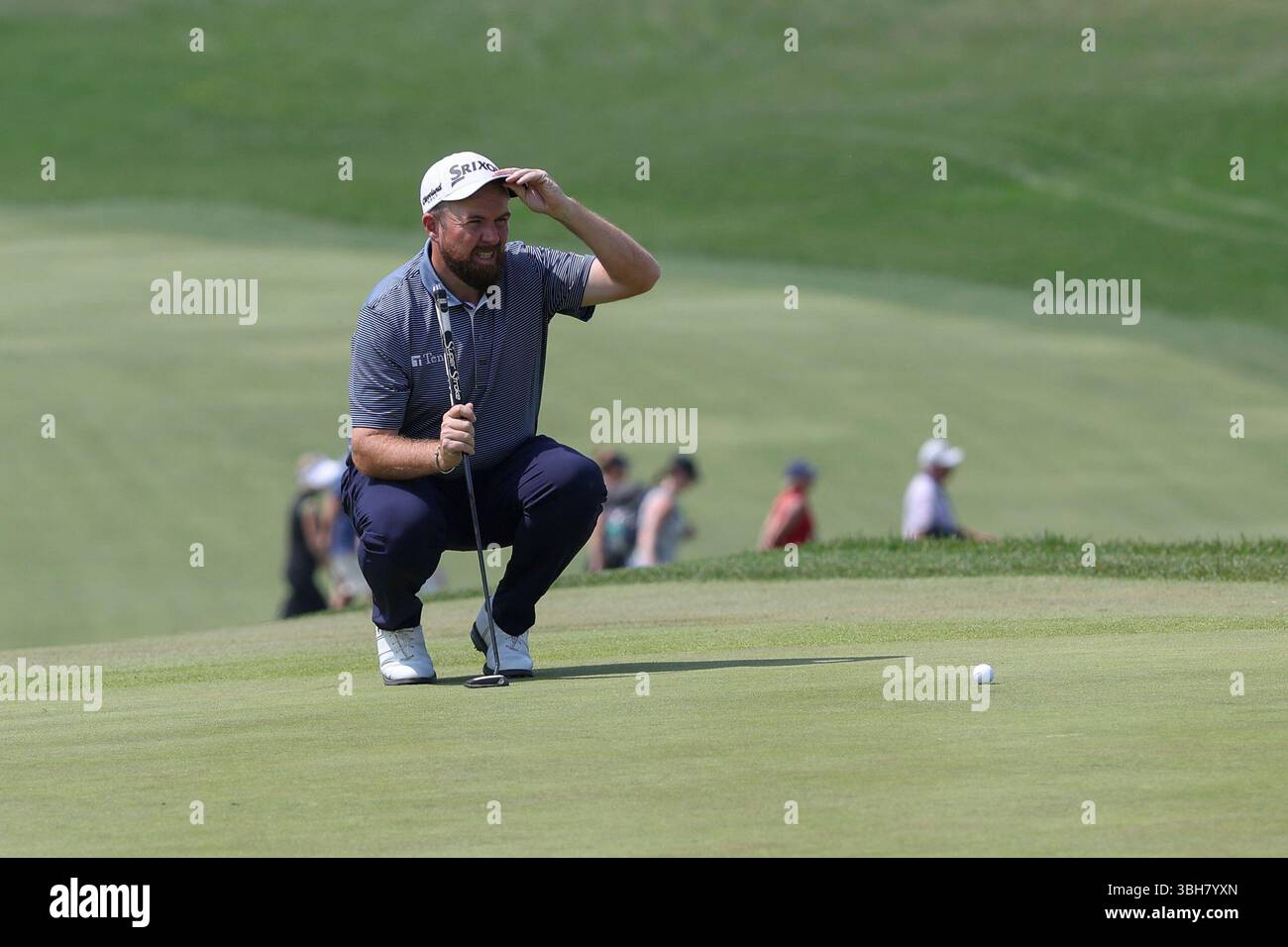 June 07, 2025: Shane Lowry examines his putting line on the ninth hole ...