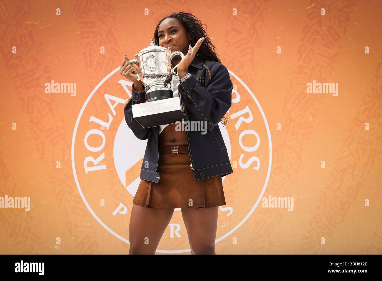 Coco Gauff, of the U.S, holds her trophy after her Saturday victory in ...
