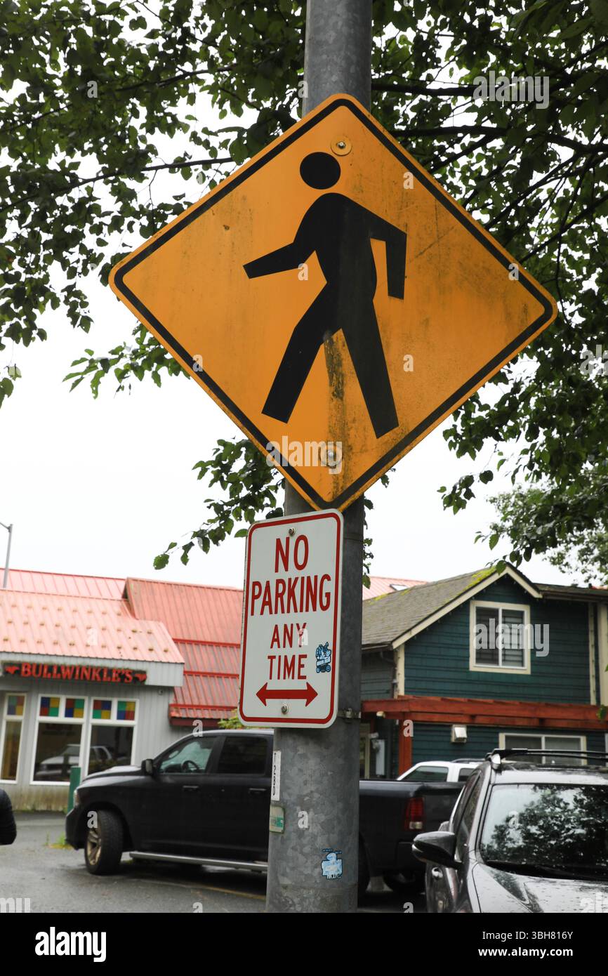 Pedestrian crossing sign. Pedestrians have priority when crossing the ...