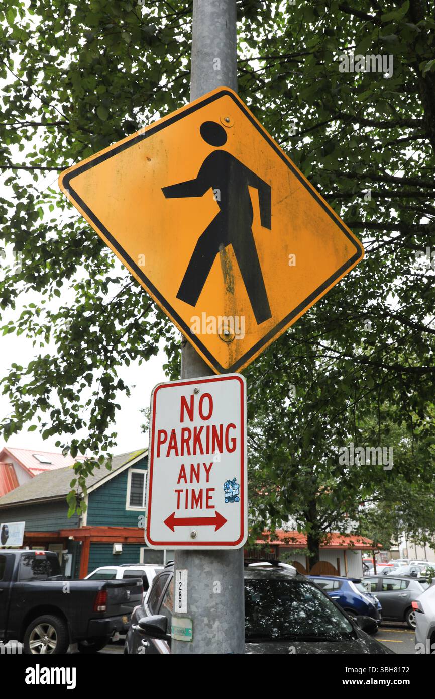 Pedestrian crossing sign. Pedestrians have priority when crossing the ...