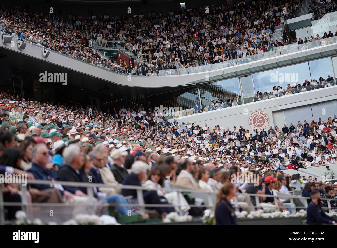 Spectators watch the final match of the French Tennis Open at the ...