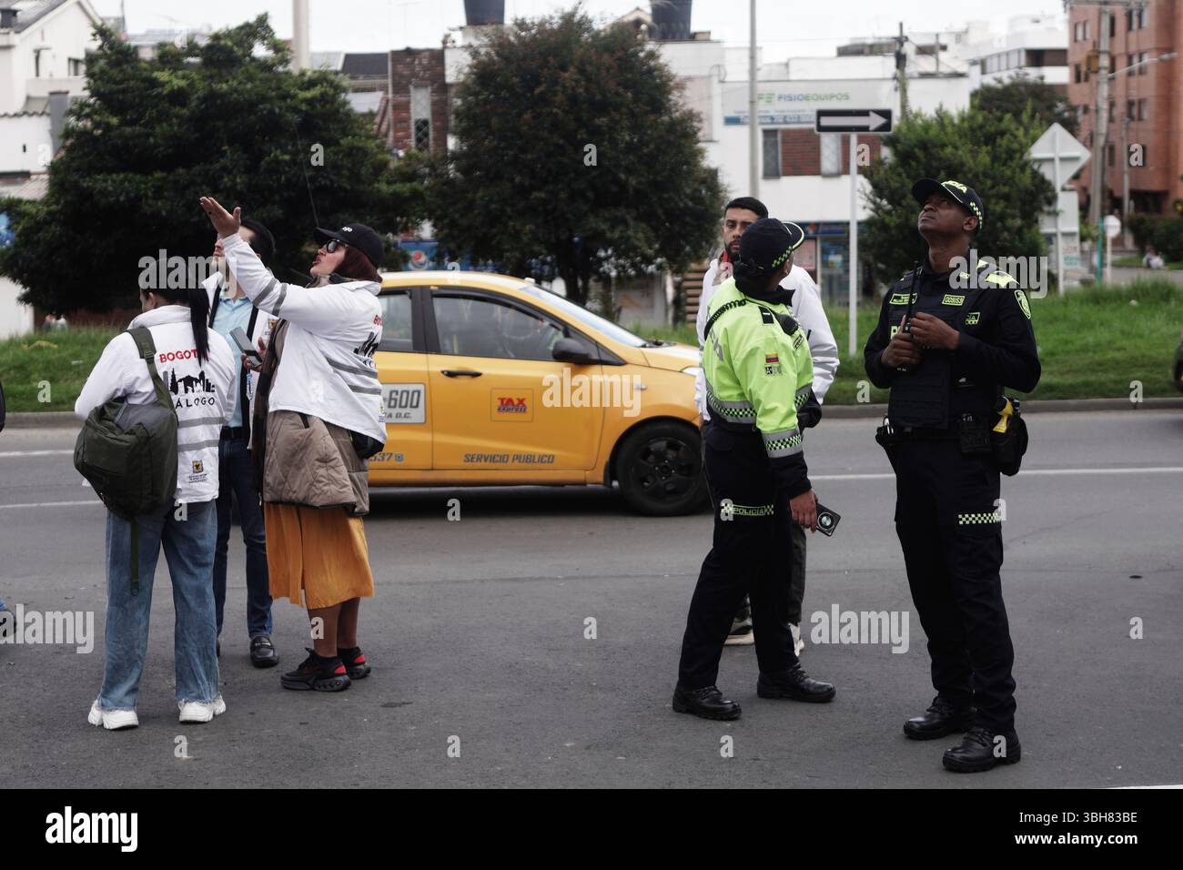 A police officer guarding the clinic where Colombian Senator Miguel ...