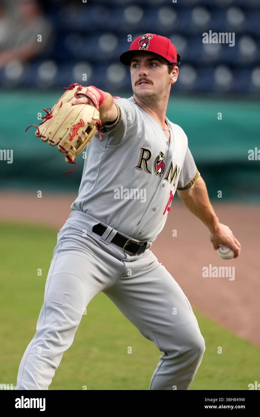 Patrick Clohisy (14) of the Rome Emperors warms up before a South ...