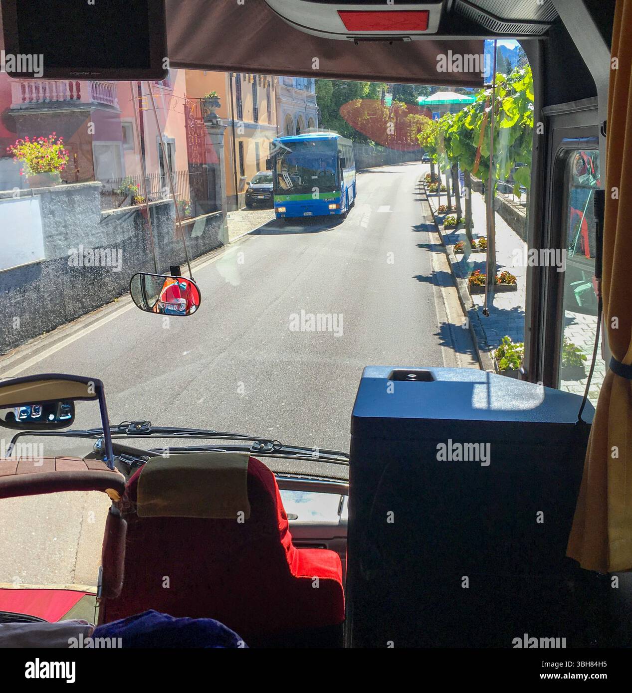 Merging buses on a narrow highway Stock Photo - Alamy
