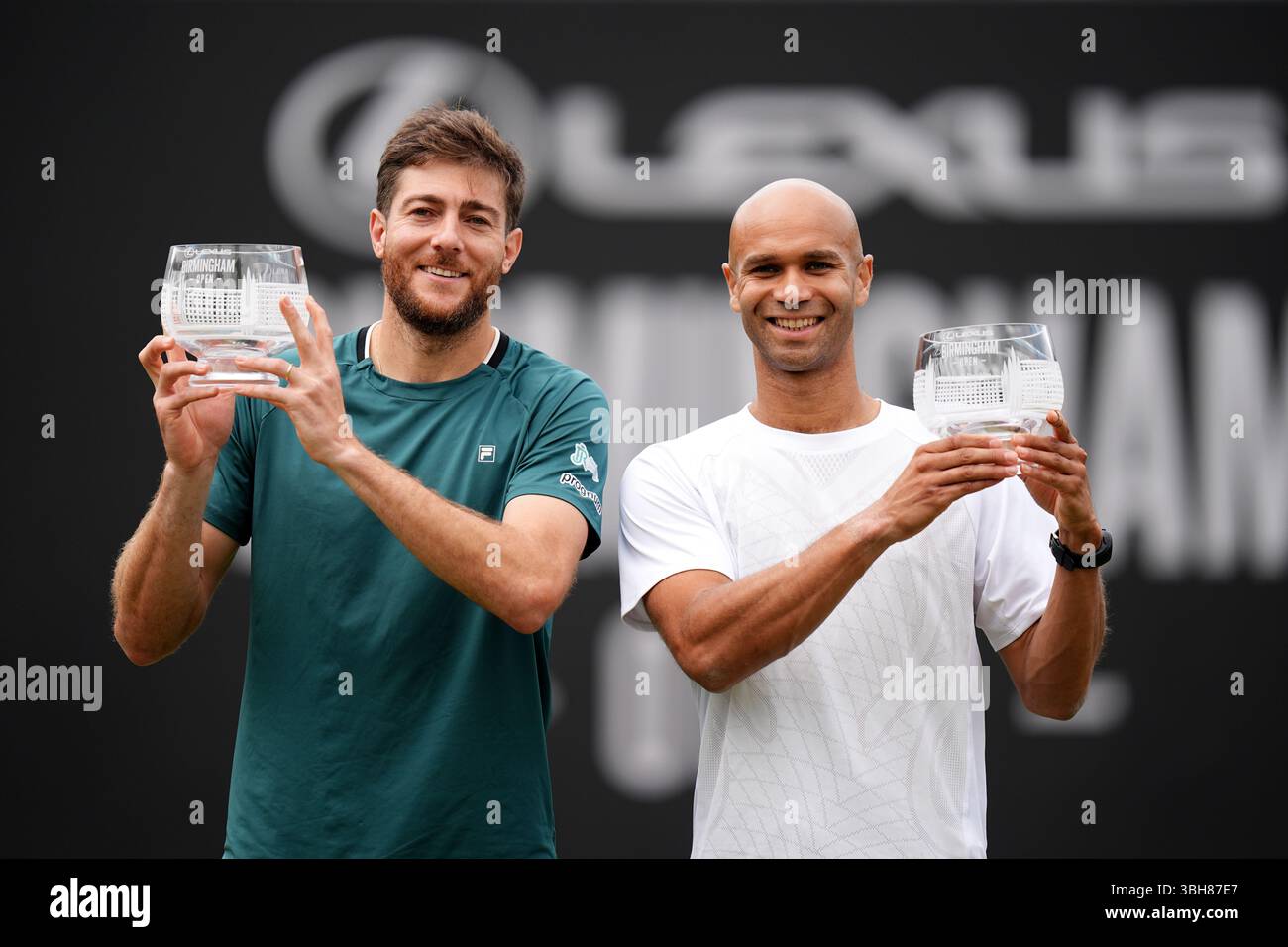 Sadio Doumbia and Marcelo Demoliner celebrate winning the Mens Doubles ...