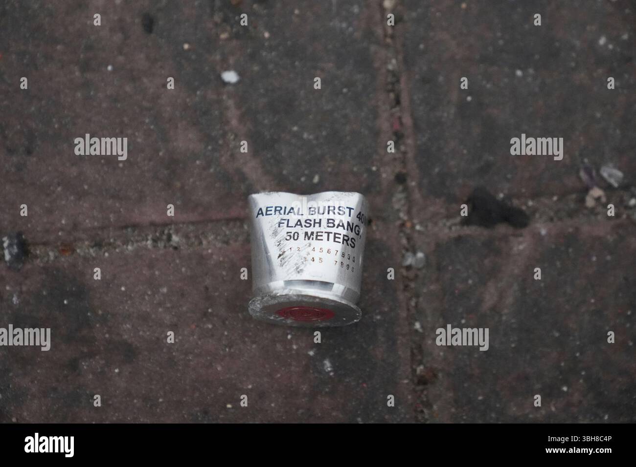 A flash bang canister lies in the street Sunday, June 8, 2025, in ...