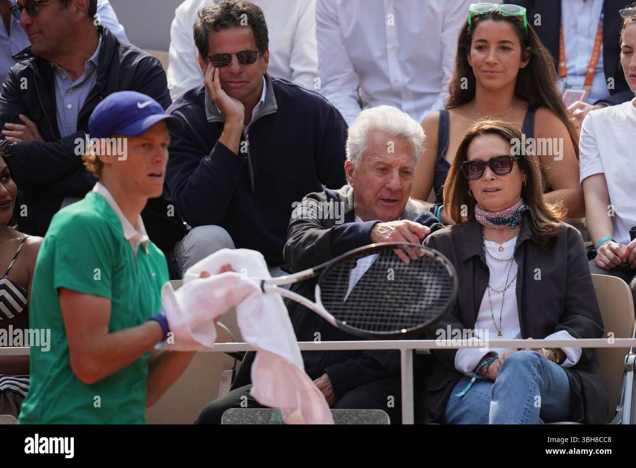Italy's Jannik Sinner passes by American movies star Dustin Hoffman and ...