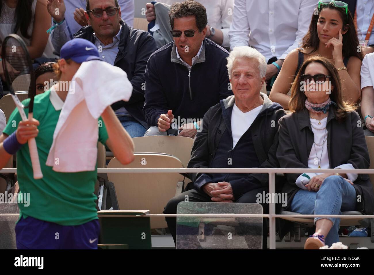 Italy's Jannik Sinner passes by American movies star Dustin Hoffman and ...