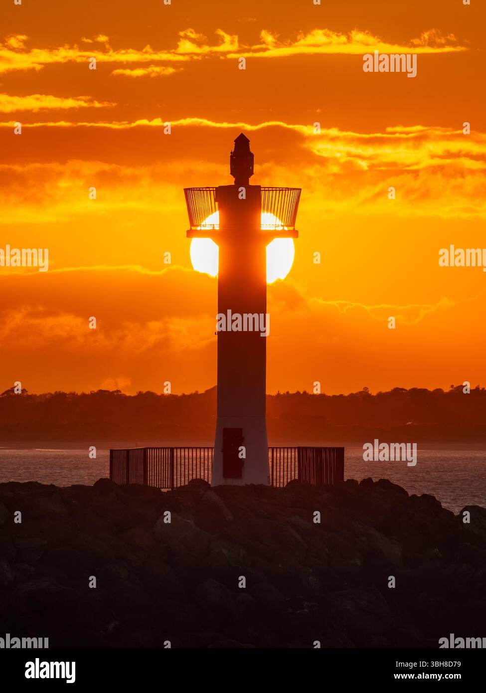 Sunset aligned with Howth Lighthouse Stock Photo - Alamy