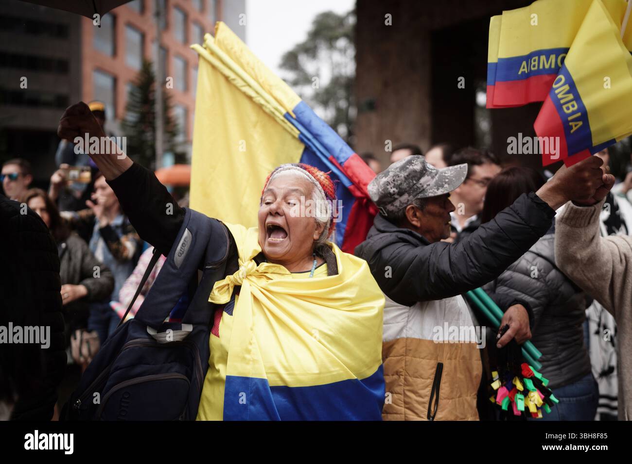 People march to the clinic where Colombian Senator Miguel Uribe Turbay ...
