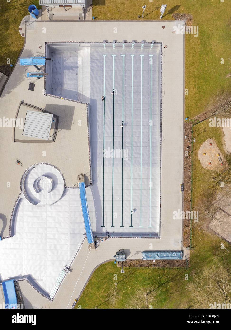 Aerial view of the swimming area with large lawn and surrounding green ...
