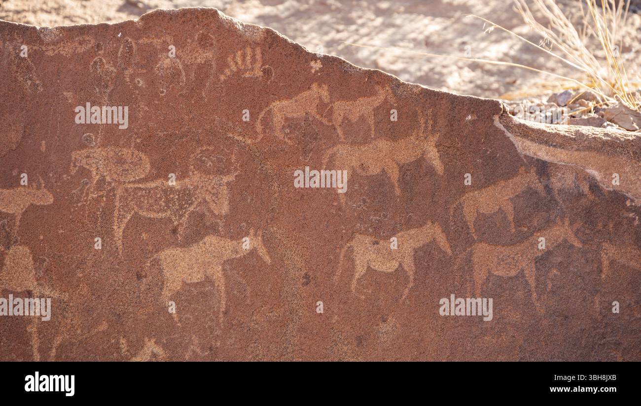 Depictions of animals on a rock slab, lion slab, rock carvings, rock ...